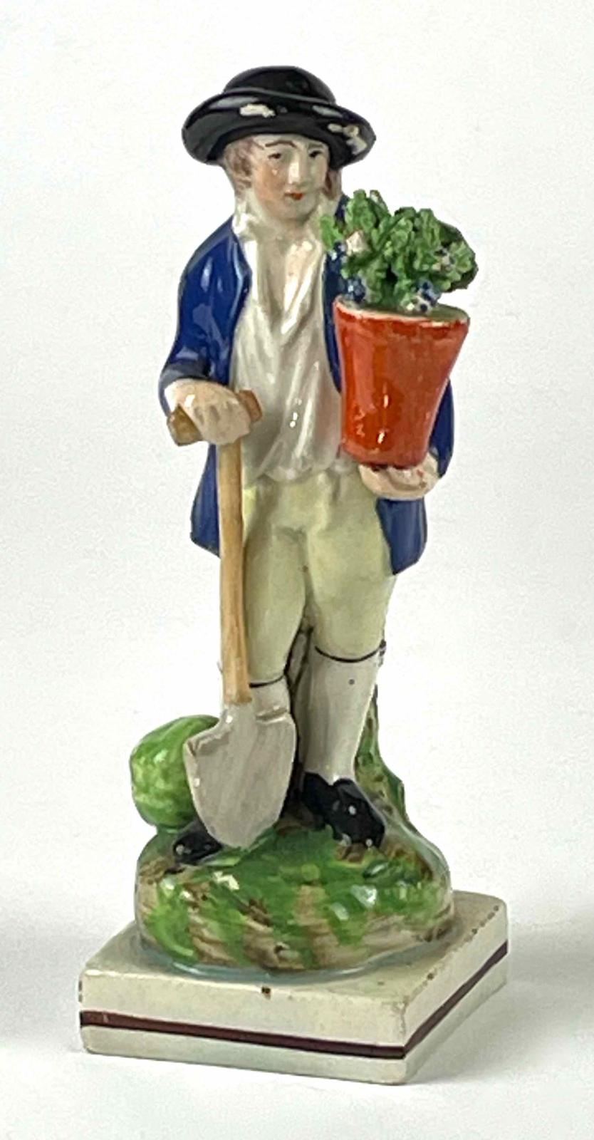 Figurine, young man with spade and flower pot | Historic Odessa Foundation